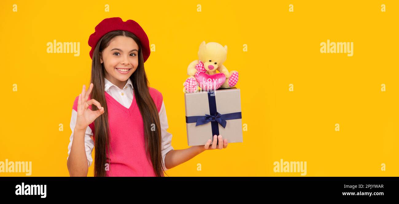 tween and youth. purchase a gift. ok gesture. happy french teen girl ...