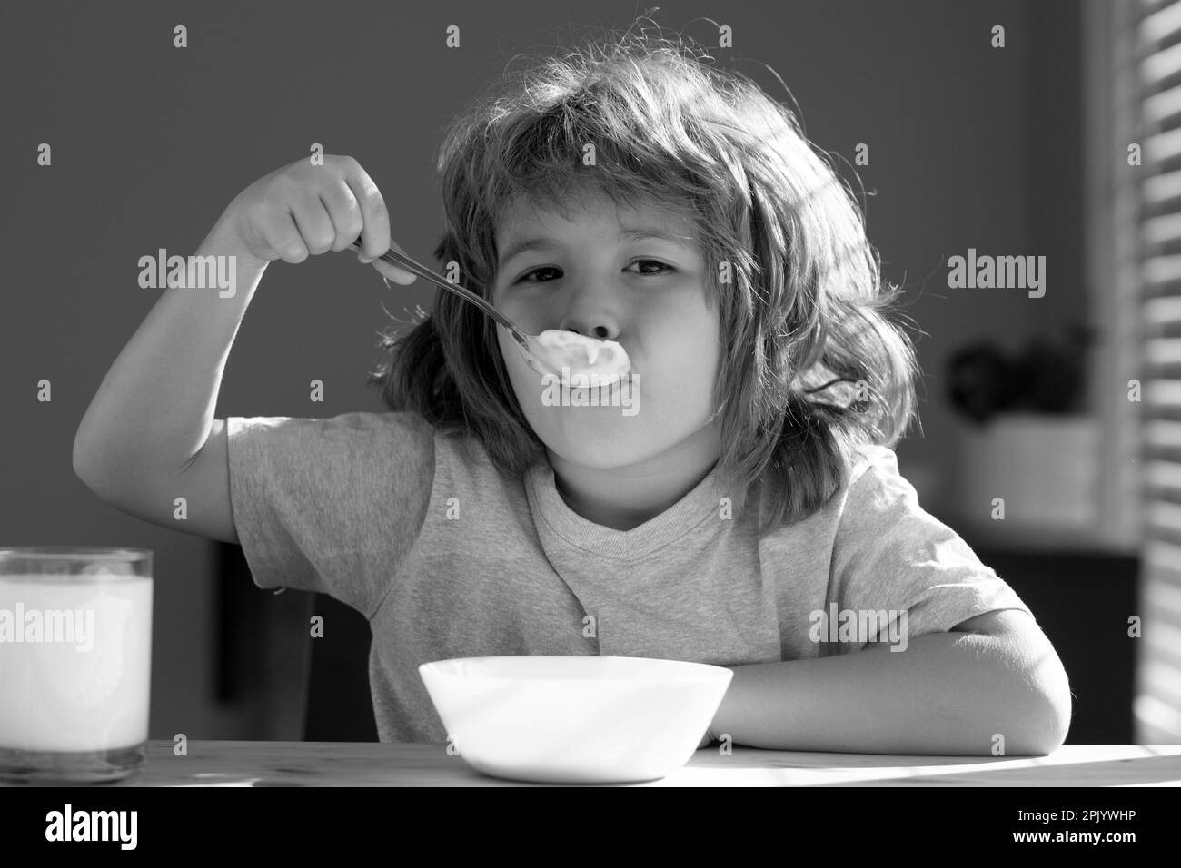Funny kid with plate of soup. Child dinner Stock Photo - Alamy