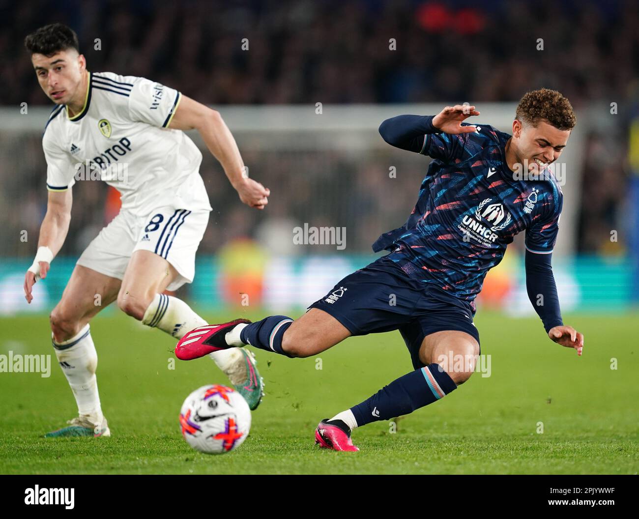 Leeds United's Marc Roca (left) and Nottingham Forest's Brennan Johnson ...