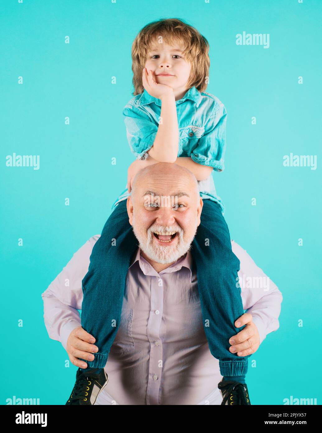 Senior man giving his grandson a piggyback. Male Family Concept ...
