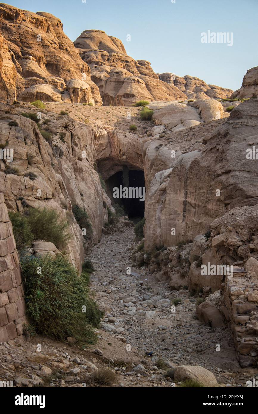 One of many historic hand carved caves in the valley of Petra. Jordan ...