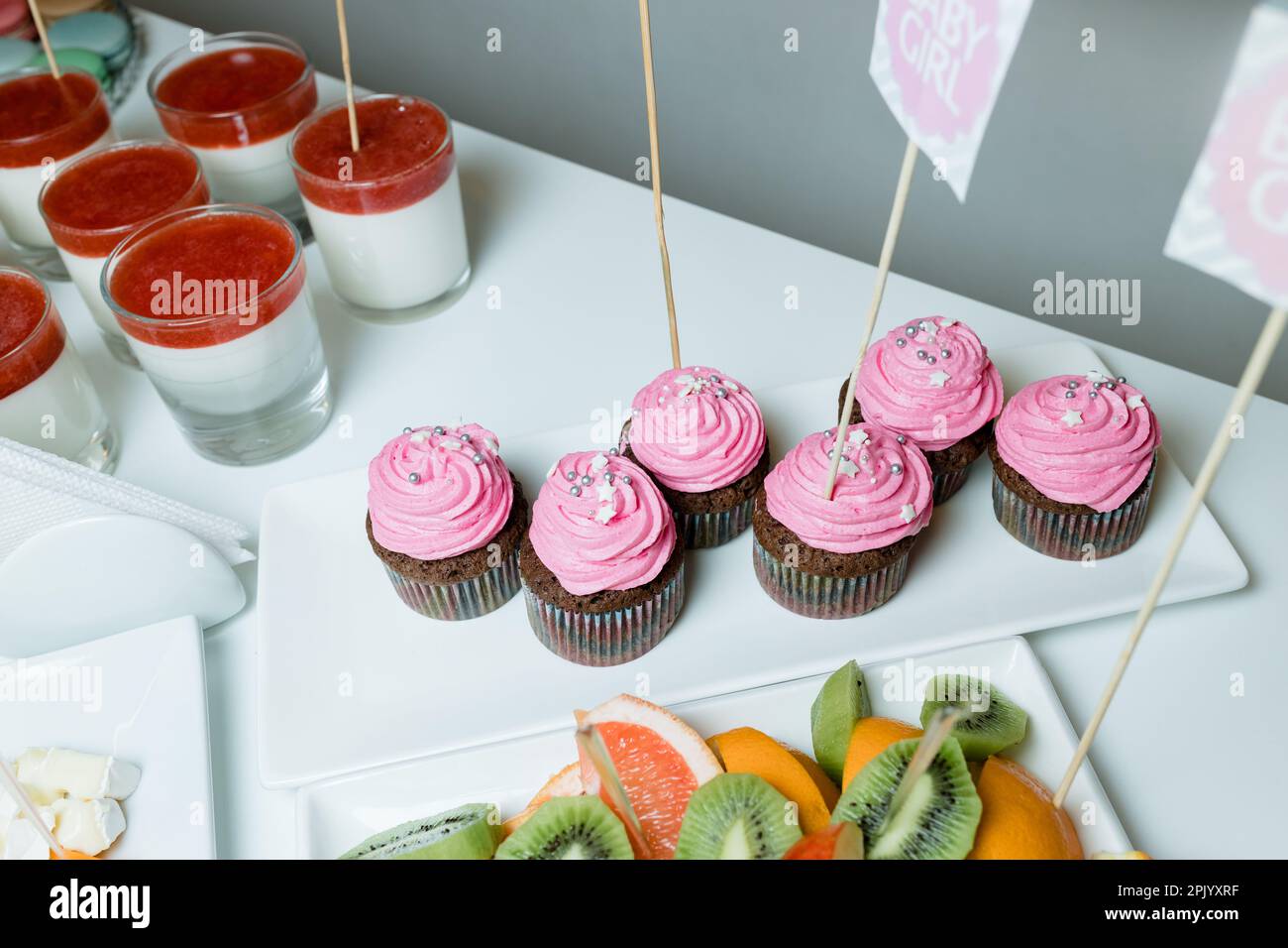 Baby shower and sweets on the table. Flash light Stock Photo - Alamy