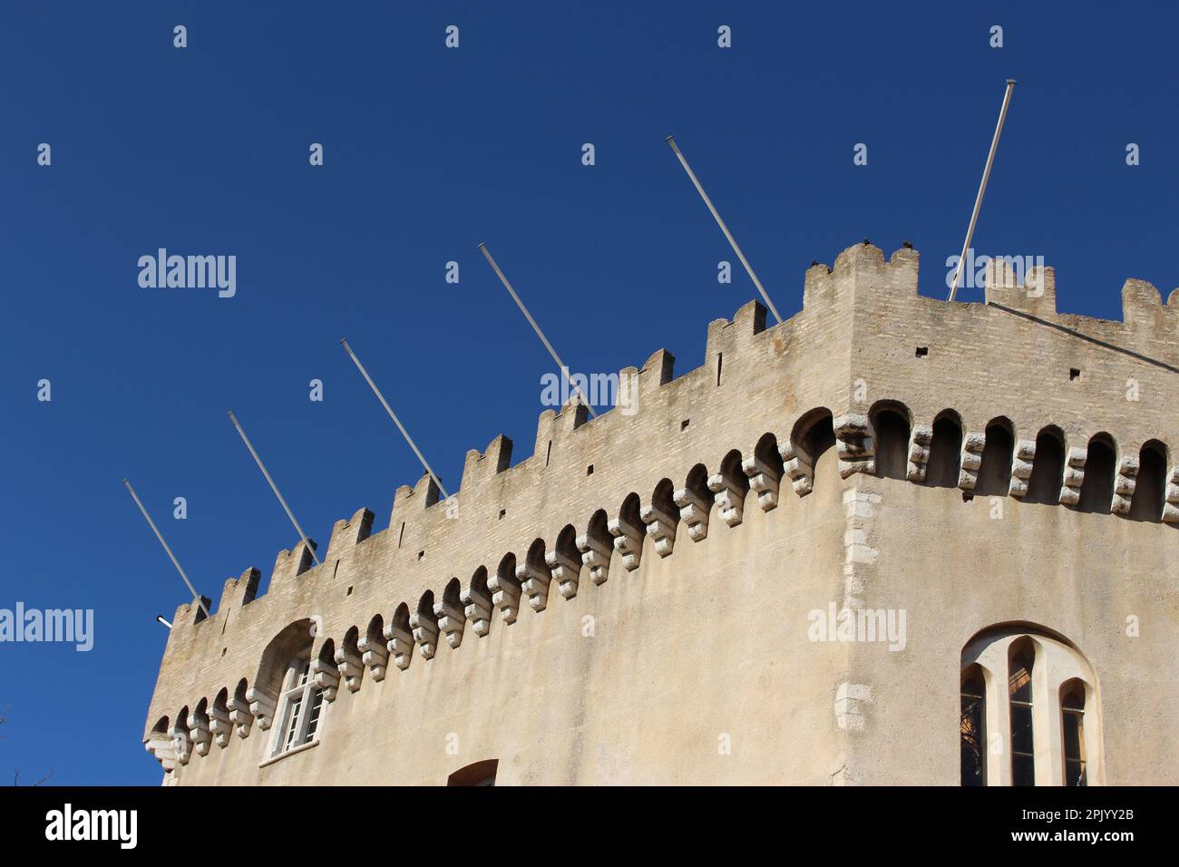 Stone façade of part of Château Grimaldi in Haut de Cagnes town square ...