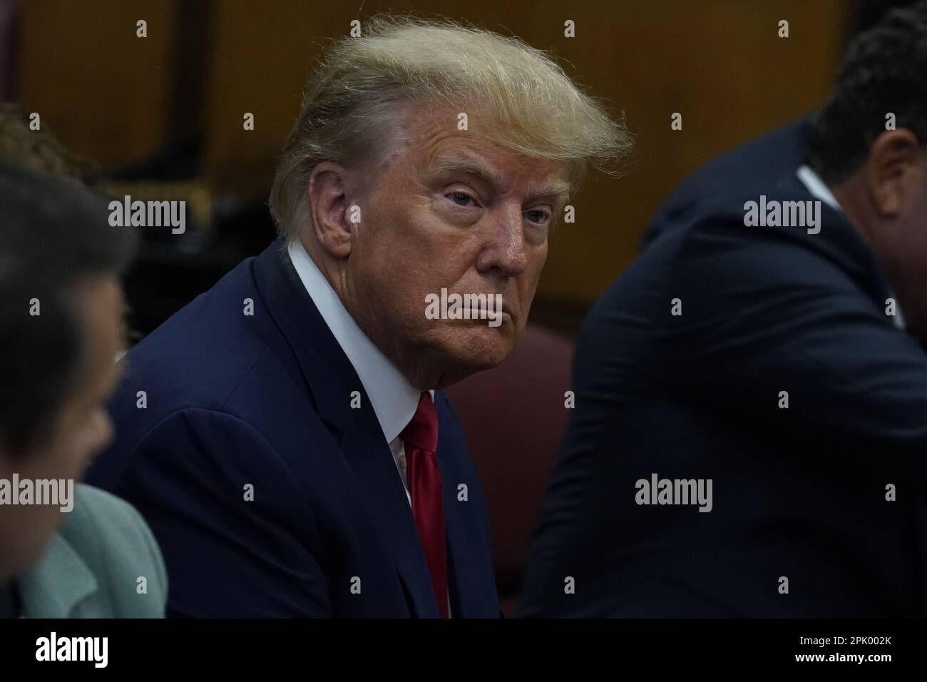 Former President Donald Trump appears in court for his arraignment ...