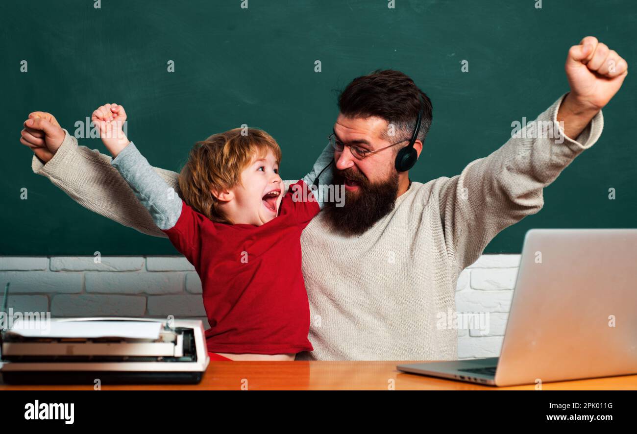 Daddy and son raising clenched fists in hooray gesture. Hooray. Family ...