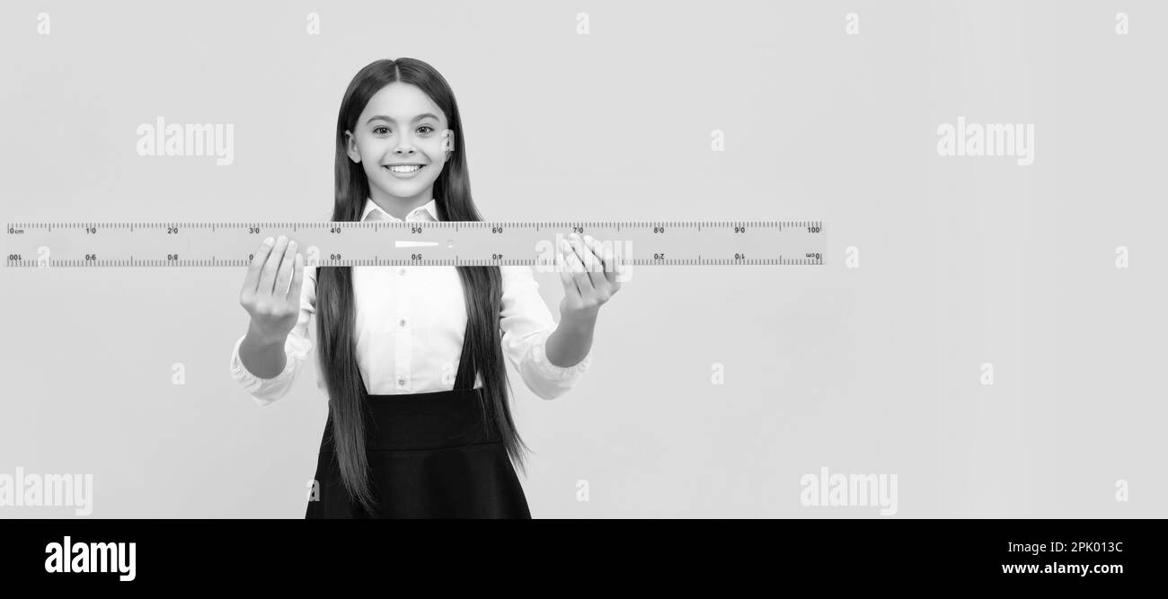 smiling teen girl hold ruler. back to school. algebra and geometry. kid ...