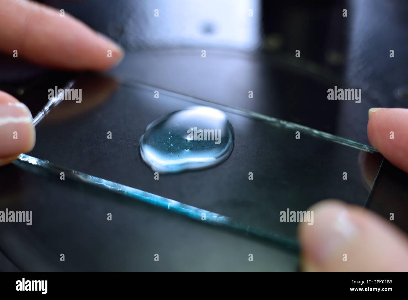 hands examining samples and liquid, extra close up Stock Photo - Alamy