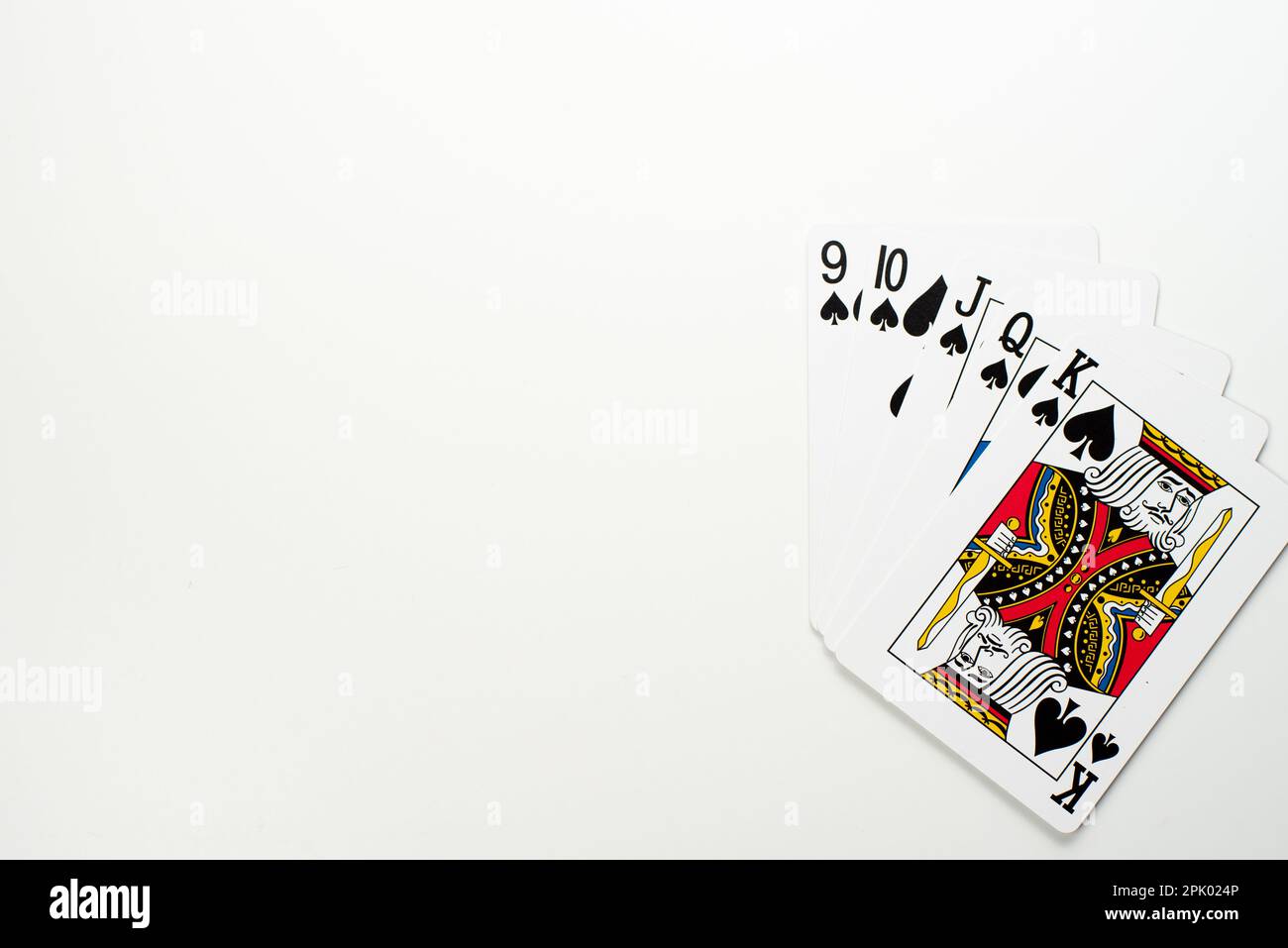 Straight Suit of Spades in lower right corner isolated on a white ...