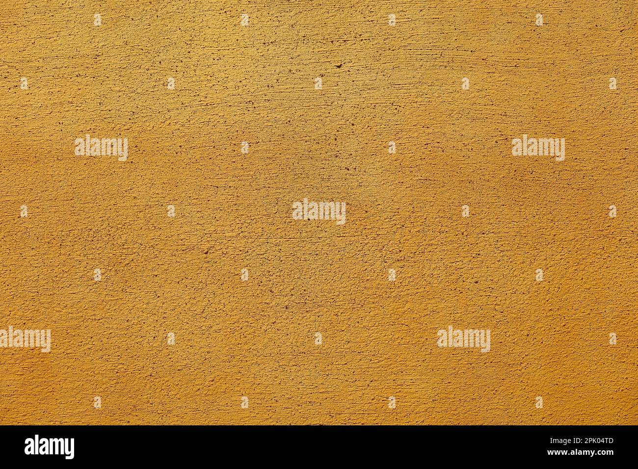 A close up photo for background material on a vivid yellow wall exposed ...