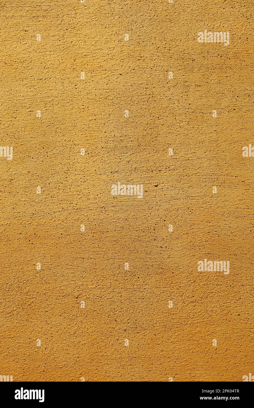 A close up photo for background material on a vivid yellow wall exposed ...