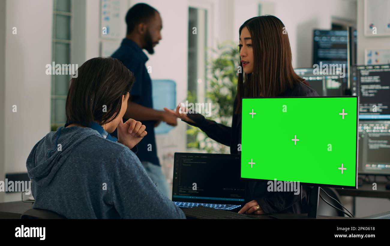 Asian It Engineers Analyzing Greenscreen On Computer And Coding Database Program With Html