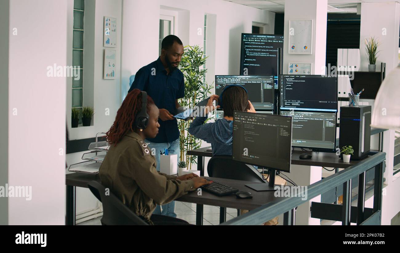 African American Focused Software Engineer Working On Computer Screen And Typing In It Office