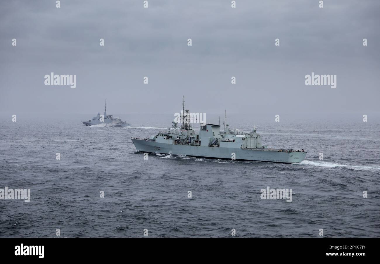 The Canadian frigate HMCS Halifax in company with the French frigate FS ...