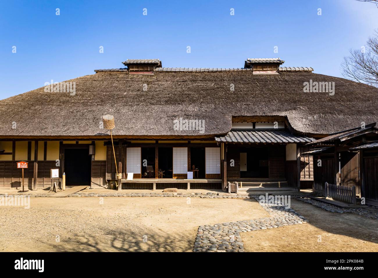 Exterior of old farmers house, thatched roof, Jidayubori park, Kitami ...