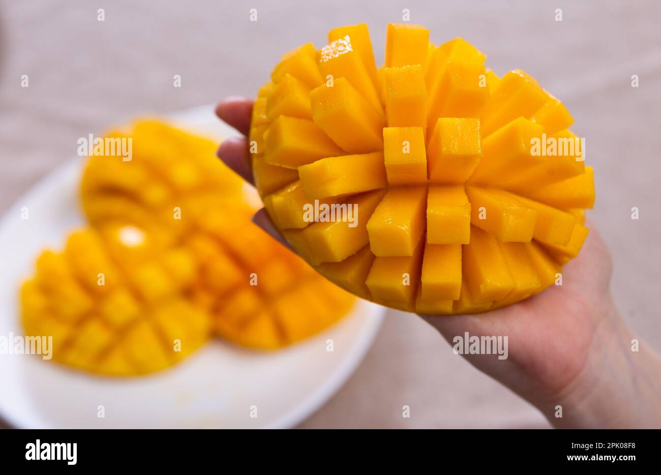 Pieces of ripe mango served on platter Stock Photo - Alamy