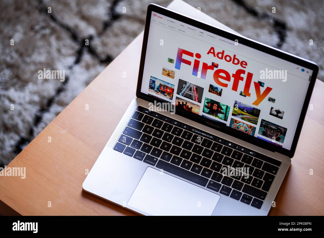 ITALY - April 4, 2023: Adobe Firefly website displayed on mac laptop ...