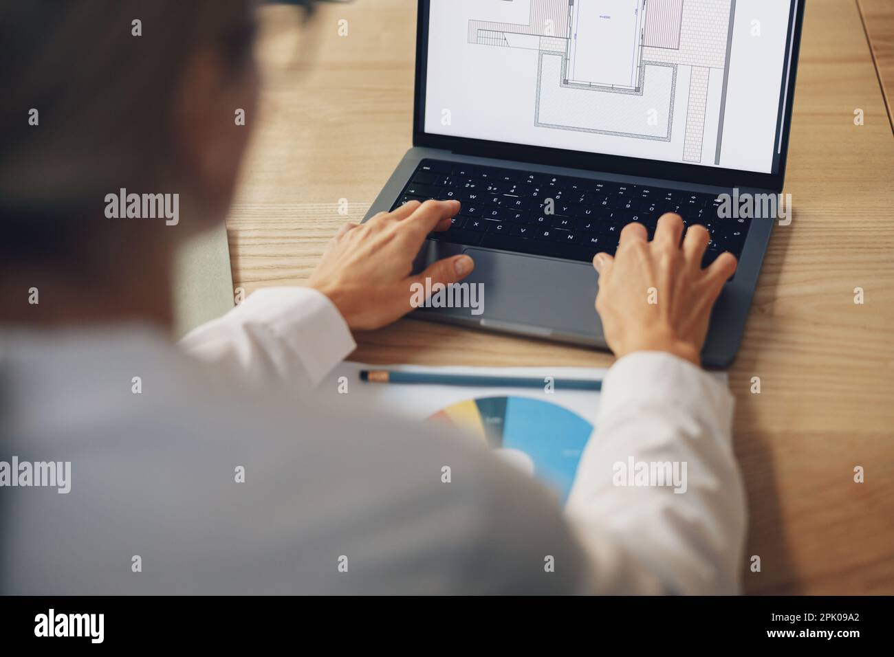Close up of woman architect creating new project on laptop while sit on ...