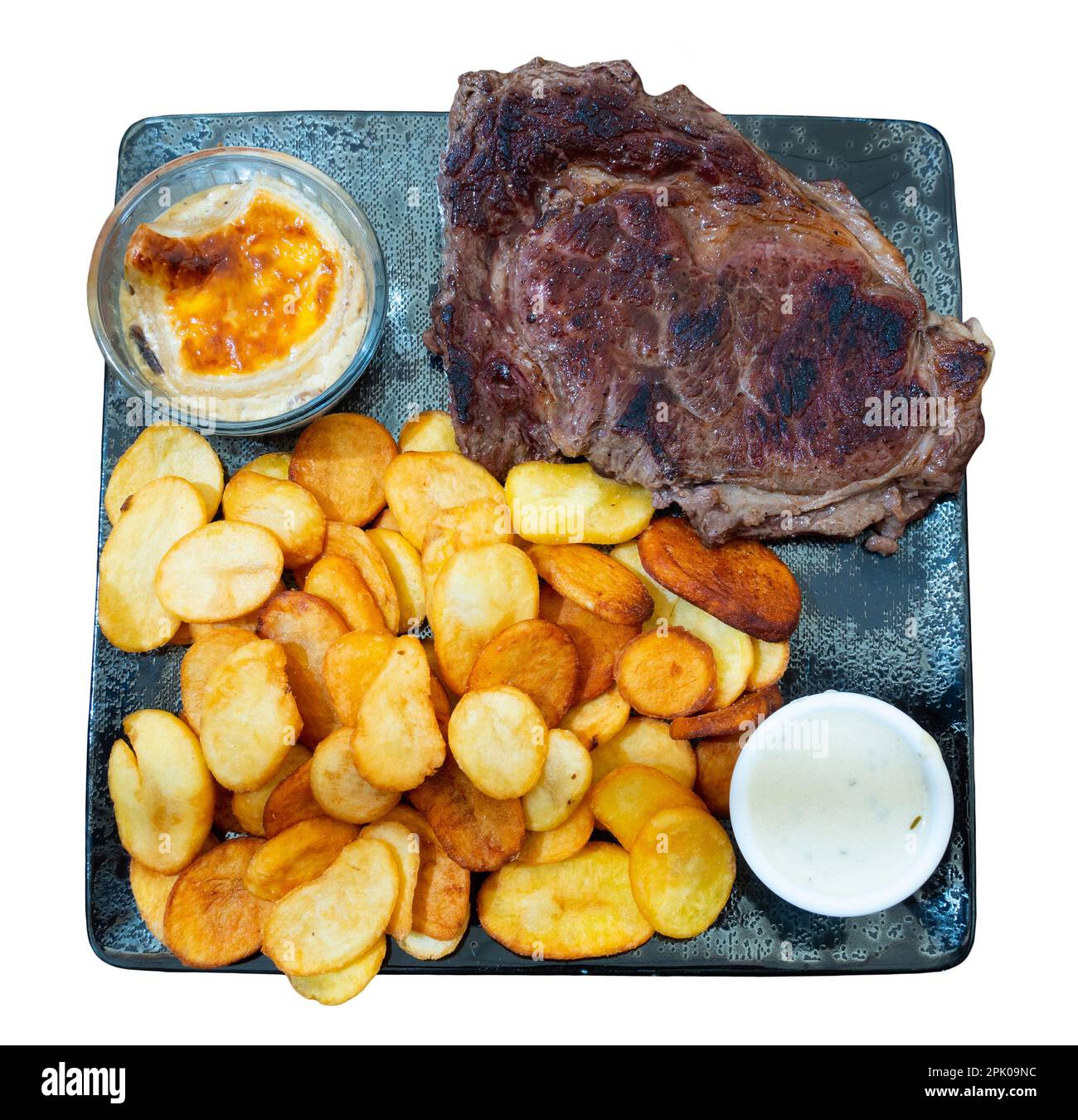 Entrecote with potato, julienne and cheese sauce Stock Photo - Alamy