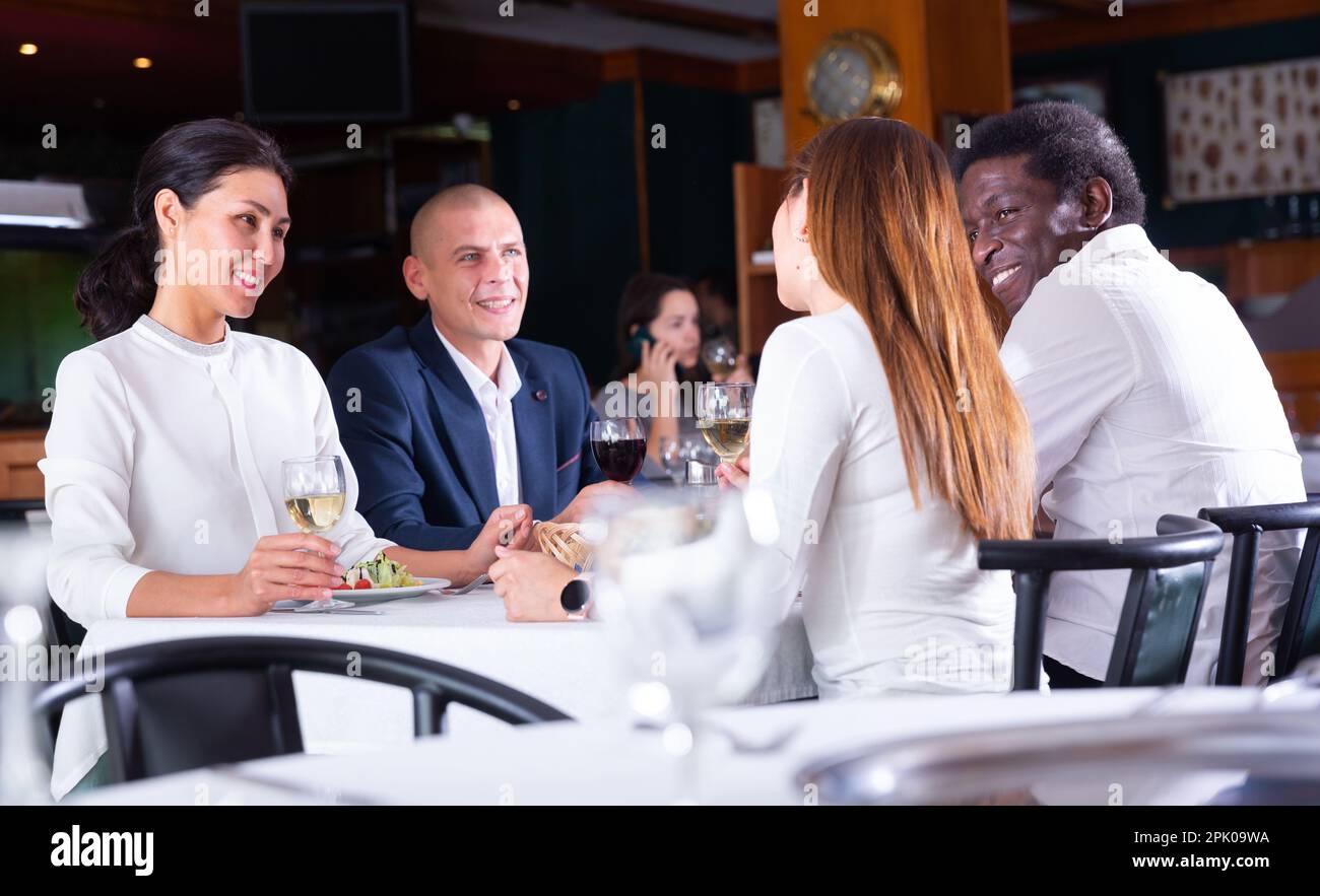 positive clients eating and drinking in cafe Stock Photo - Alamy