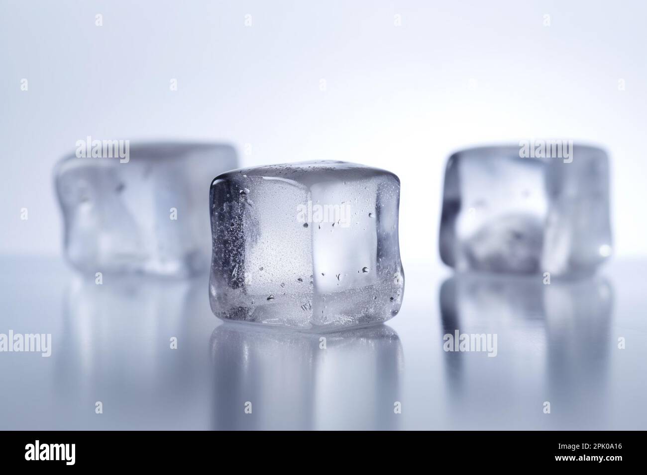 Three ice cubes on white background Stock Photo - Alamy