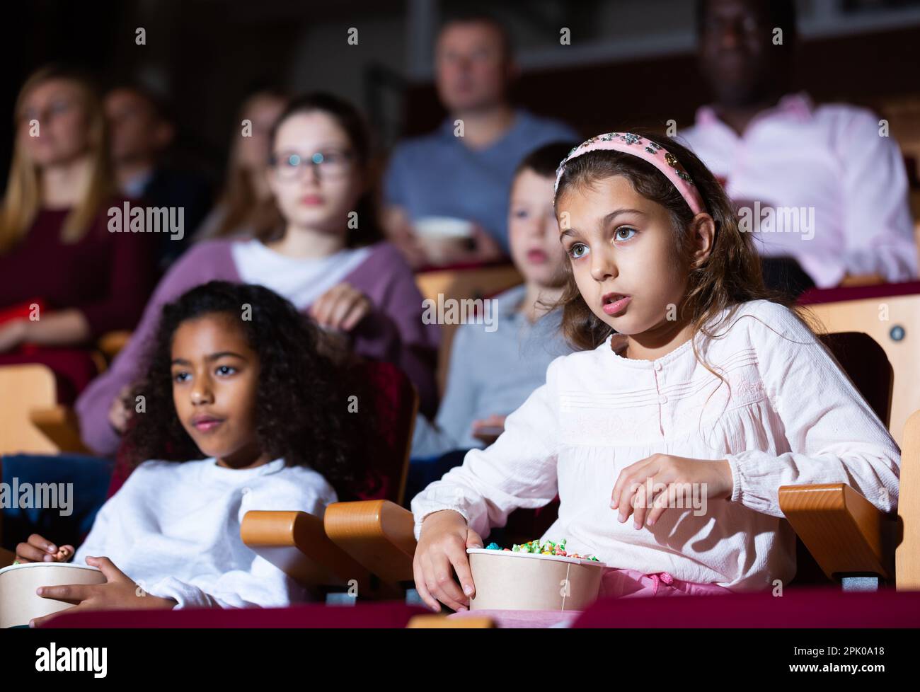 kids sitting at movie in auditorium in cinema Stock Photo - Alamy