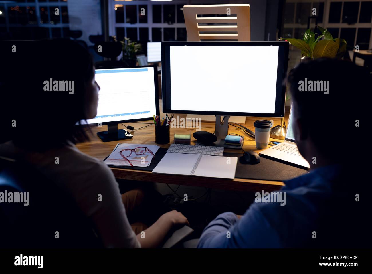 Diverse business people at desk, using computers with copy space on ...