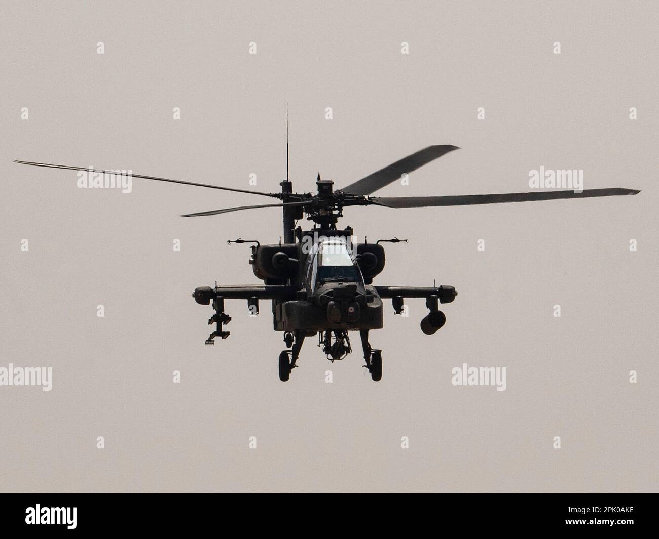 An AH-64 Apache from Task Force Spartan flies toward the gun line the ...