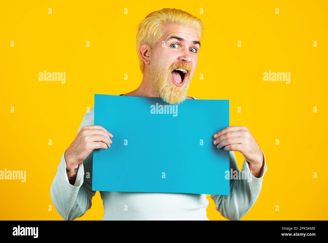 Happy Man holding big sign board. Red head man holding a banner. Men ...