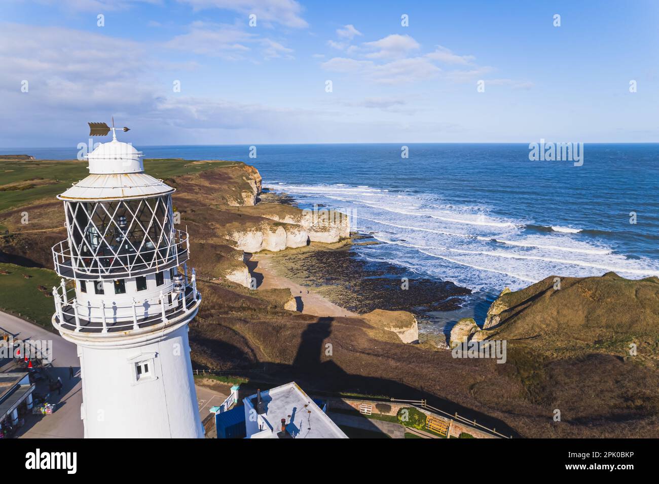 Flamborough Head Lighthouse. Drone aerial view of white beacon next to ...
