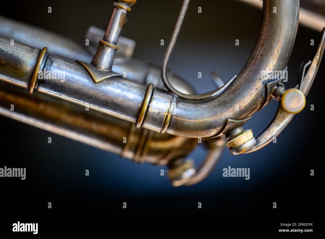 Selective focus on a water key of an aged wind instrument trumpet Stock ...