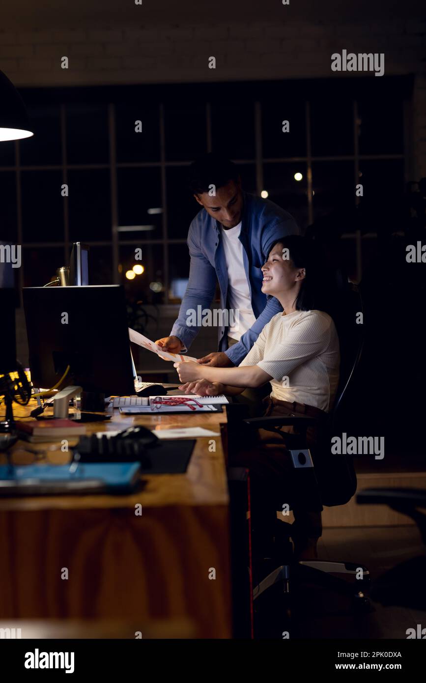 Diverse business people using computer hi-res stock photography and ...