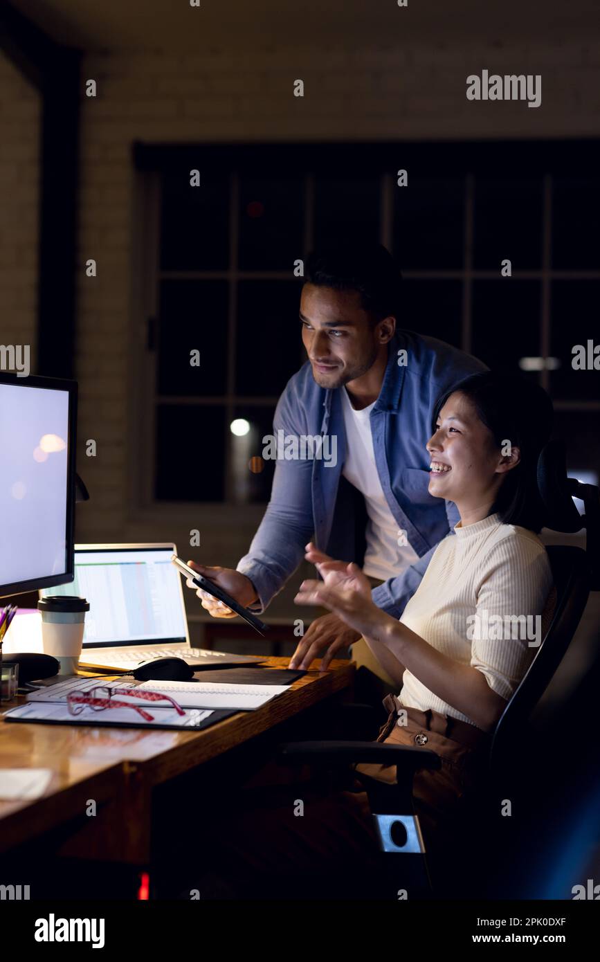 Diverse business people using computer hi-res stock photography and ...