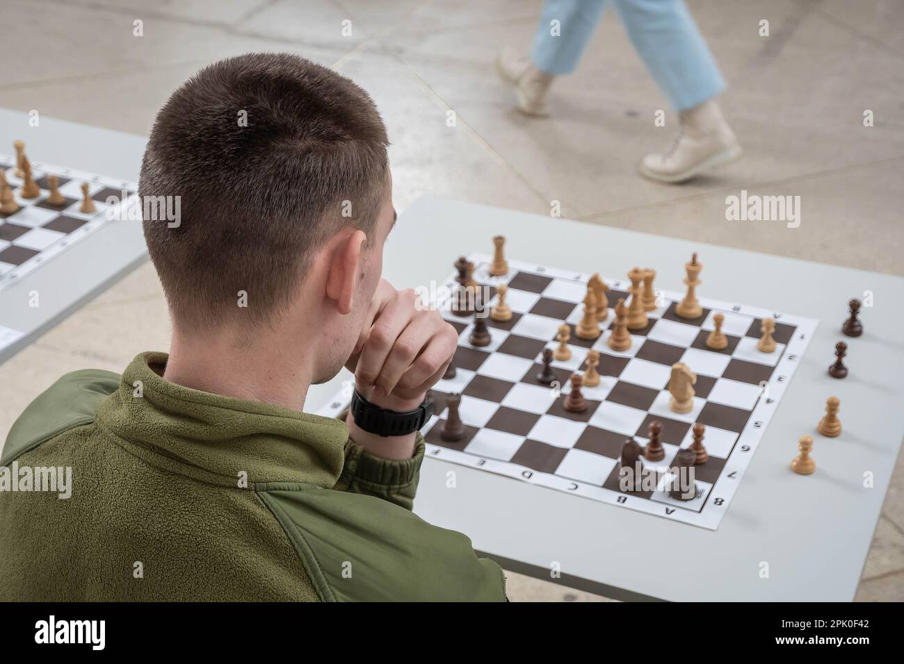 March 29, 2023, Lviv, Ukraine: A military man plays chess in a ...