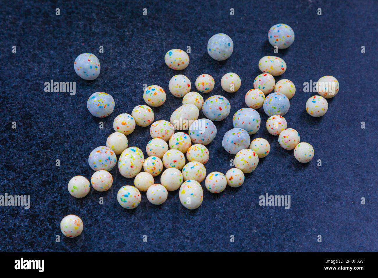 Random balls and pebbles abandoned on an external surface in the rain ...