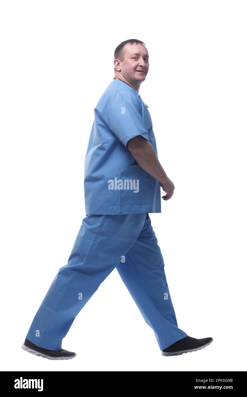 confident male doctor striding forward. isolated on a white background ...