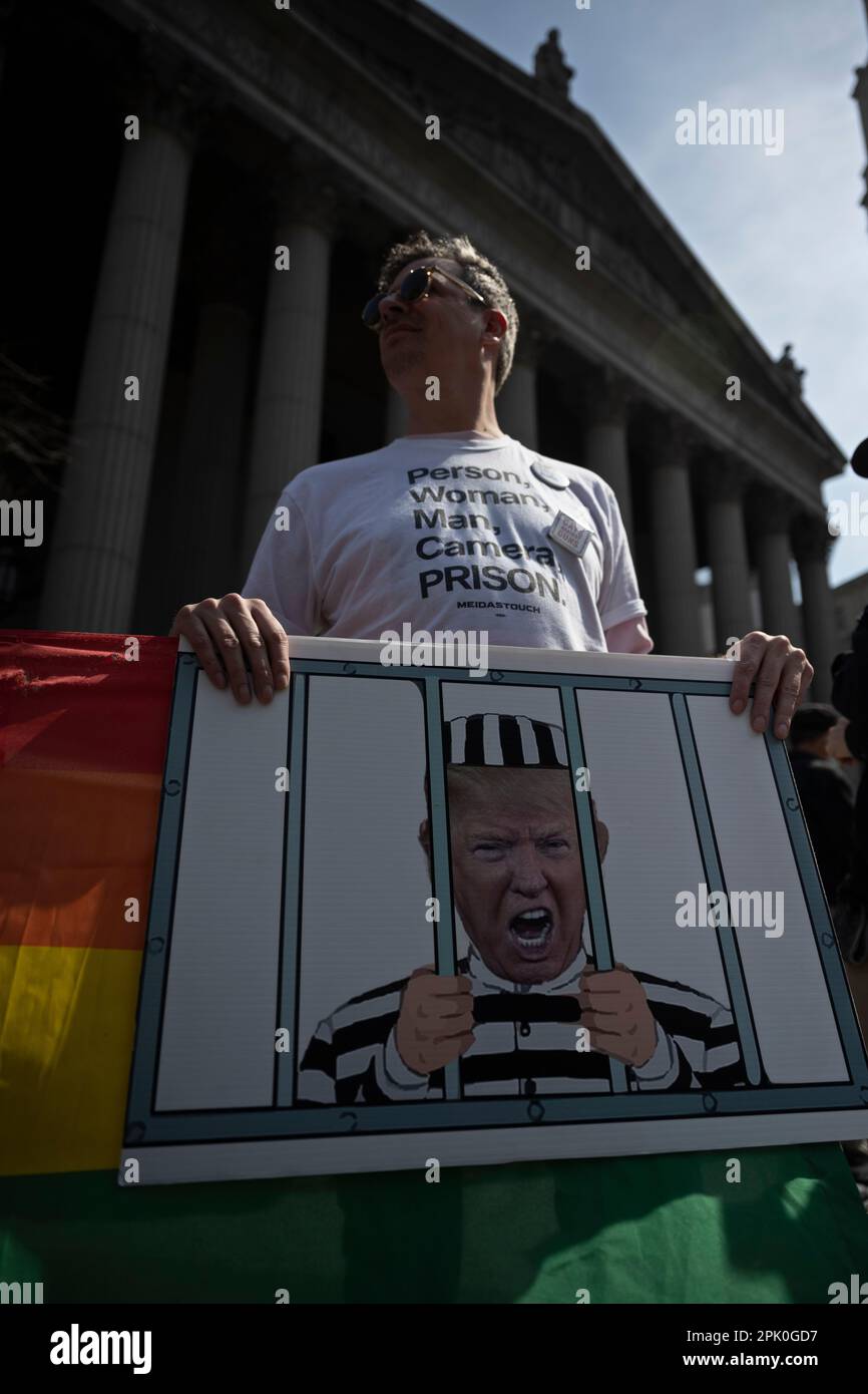 New York, USA 4 April 2023 Anti-Trump protester, with sign depicting ...