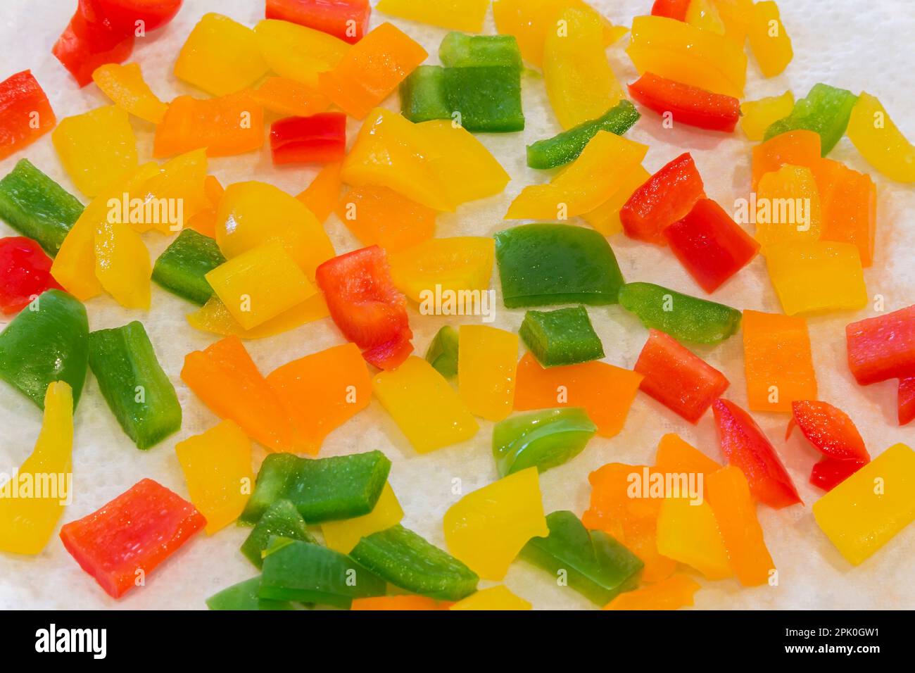 Diced raw red, yellow, orange and green Capsicum annuum - Bell Peppers ...