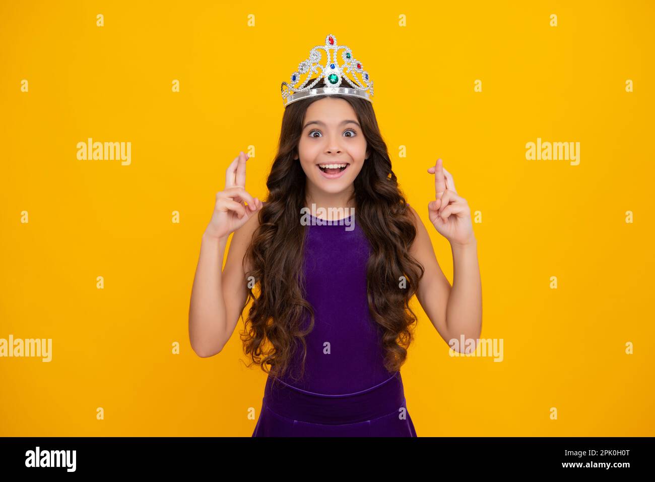 Portrait of ambitious teenage girl with crown, feeling princess ...
