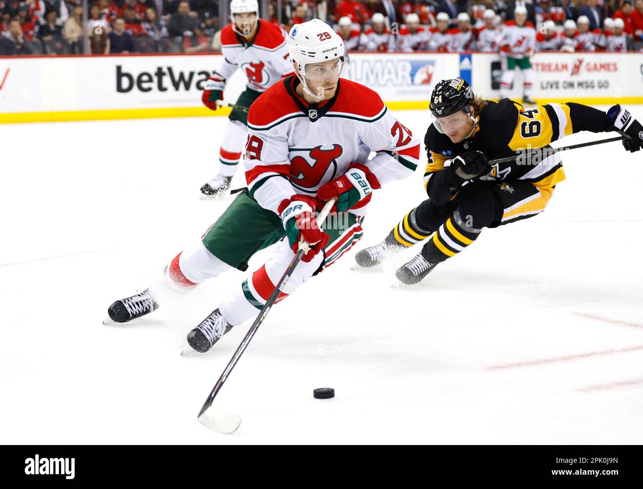 New Jersey Devils defenseman Damon Severson (28) skates with the puck ...