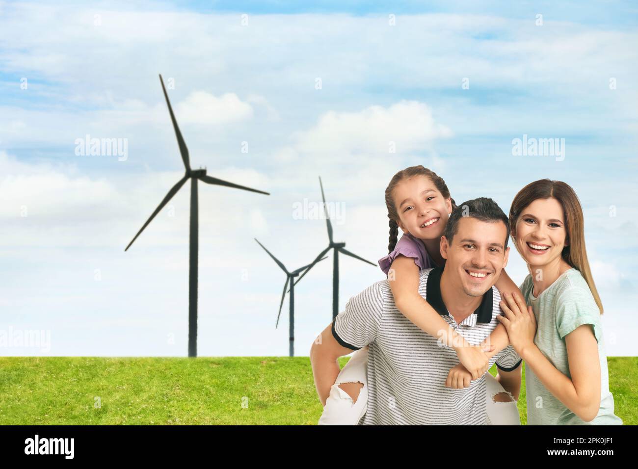 Happy family with child and view of wind energy turbines Stock Photo ...