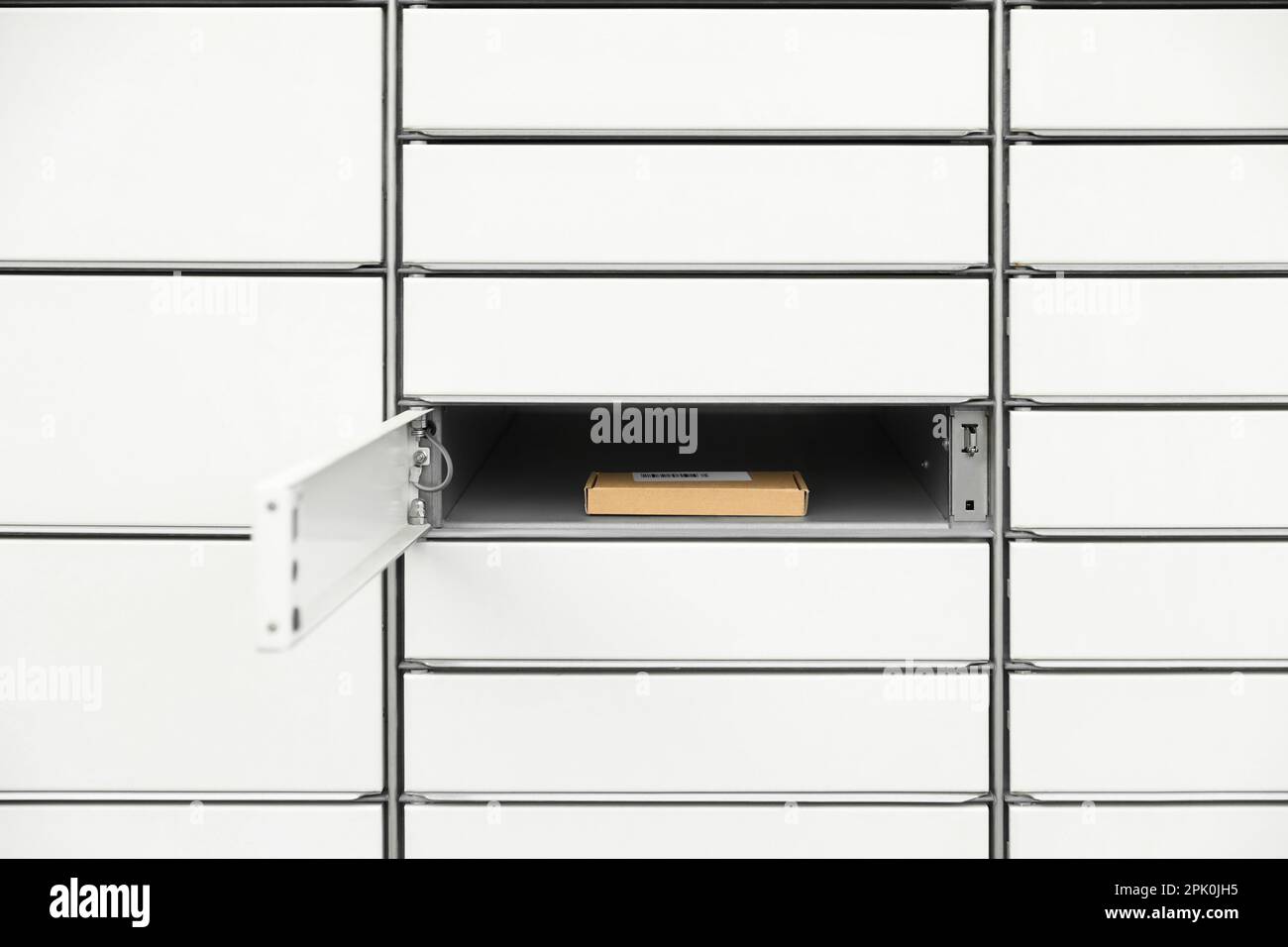Parcel in locker of automated postal box Stock Photo - Alamy