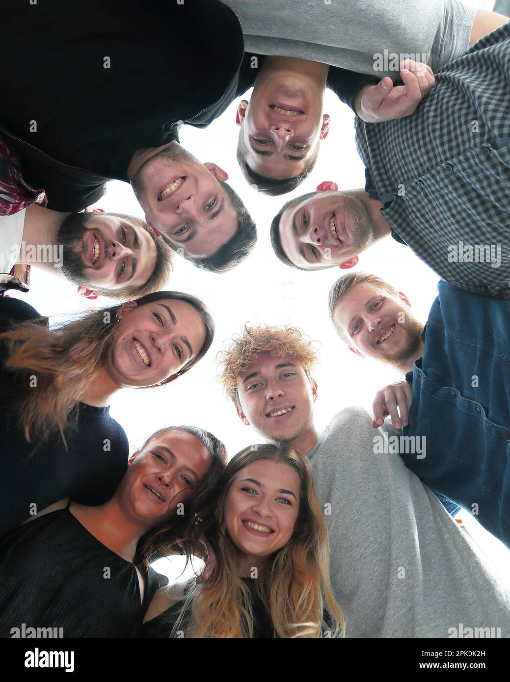 bottom view. group of smiling young people standing in a circle Stock ...