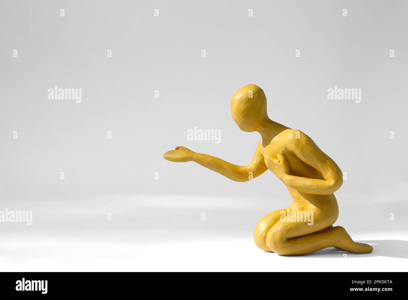 Plasticine figure of human asking help on white background. Space for ...