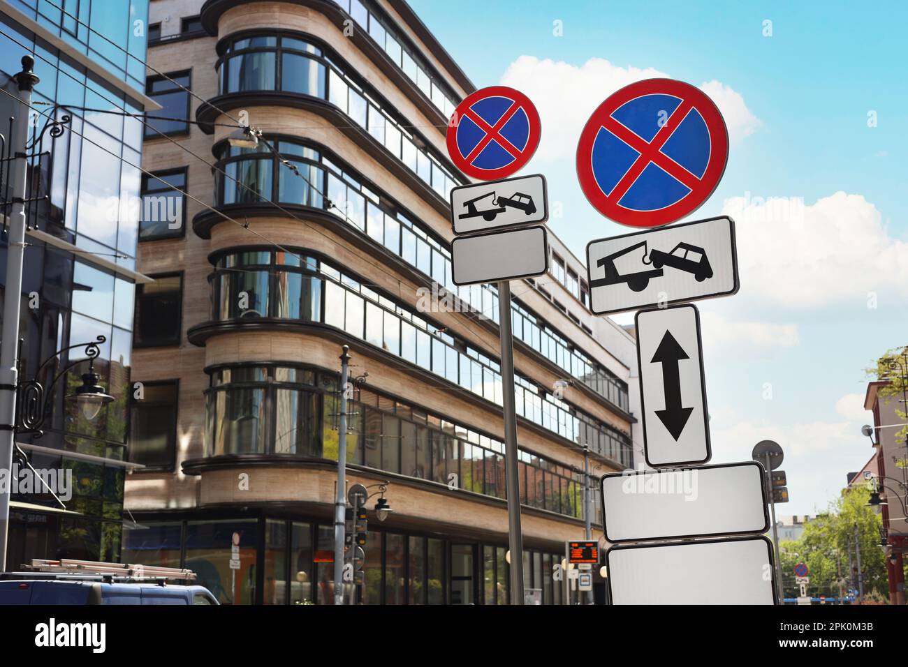 Posts with No stopping road signs and complementary plates on city ...