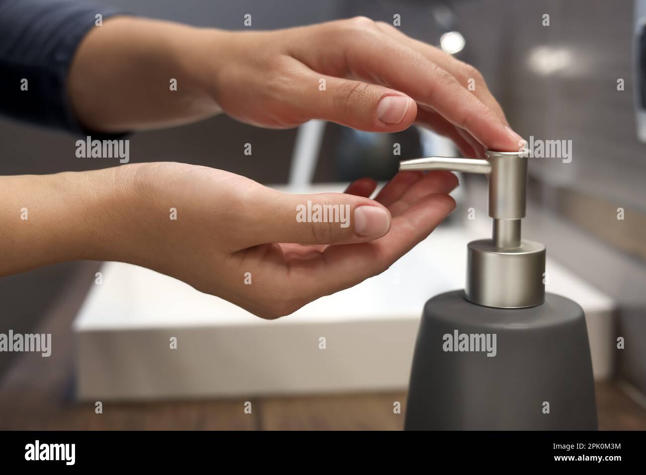 Person cleaning hands using liquid hi-res stock photography and images ...