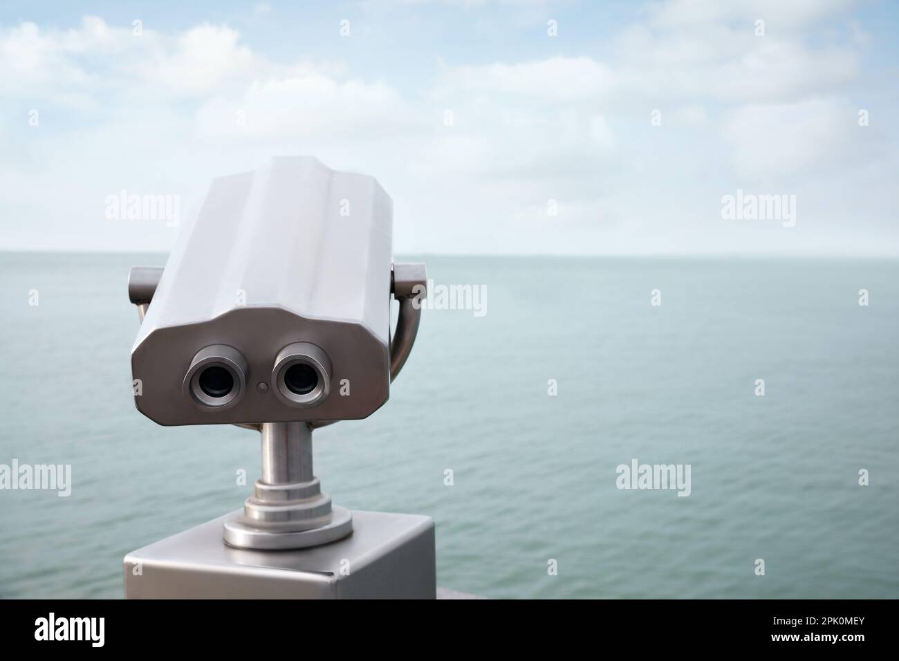 Metal tower viewer installed near sea, space for text. Mounted ...