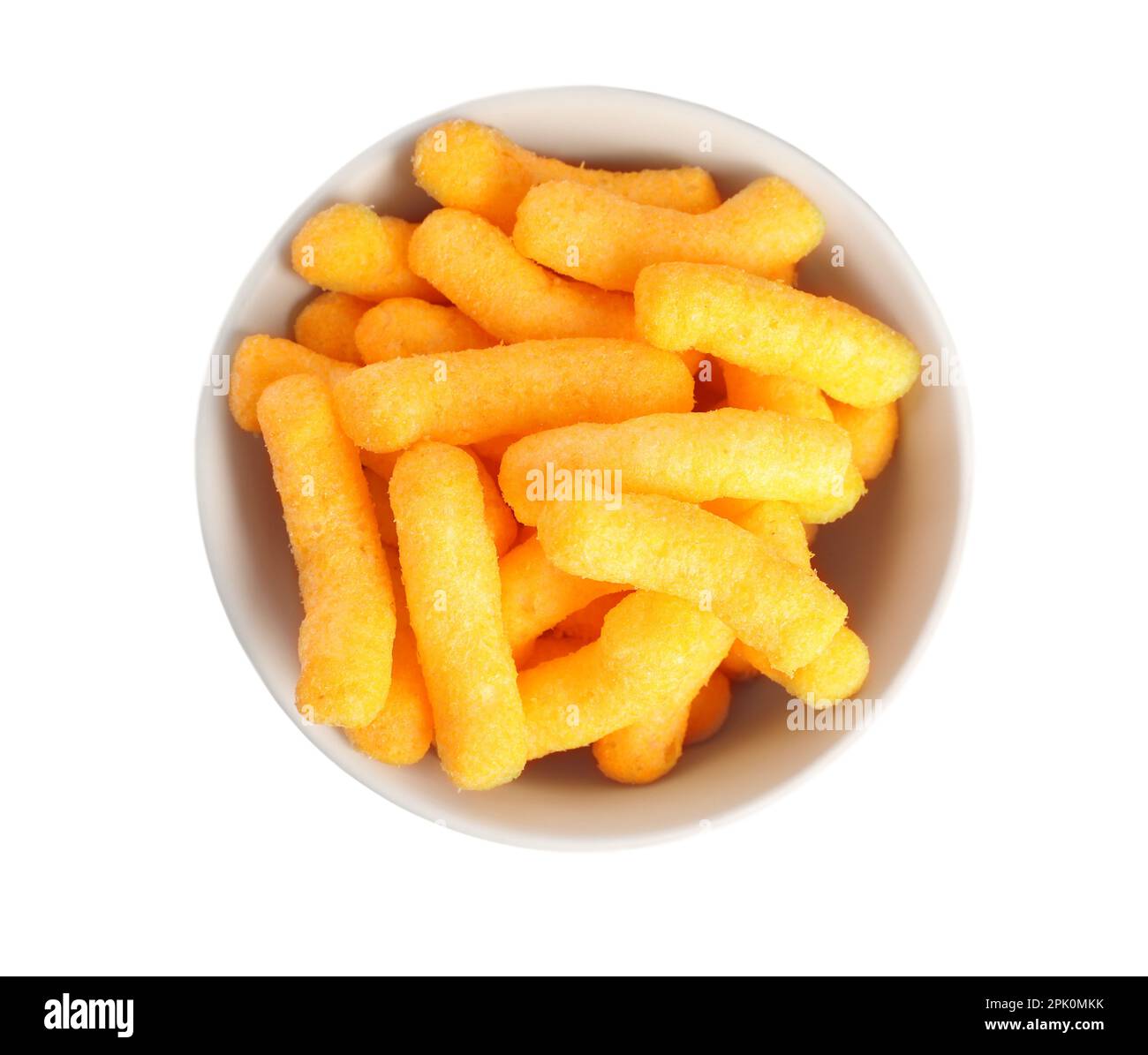 Many tasty cheesy corn puffs in bowl isolated on white, top view Stock ...