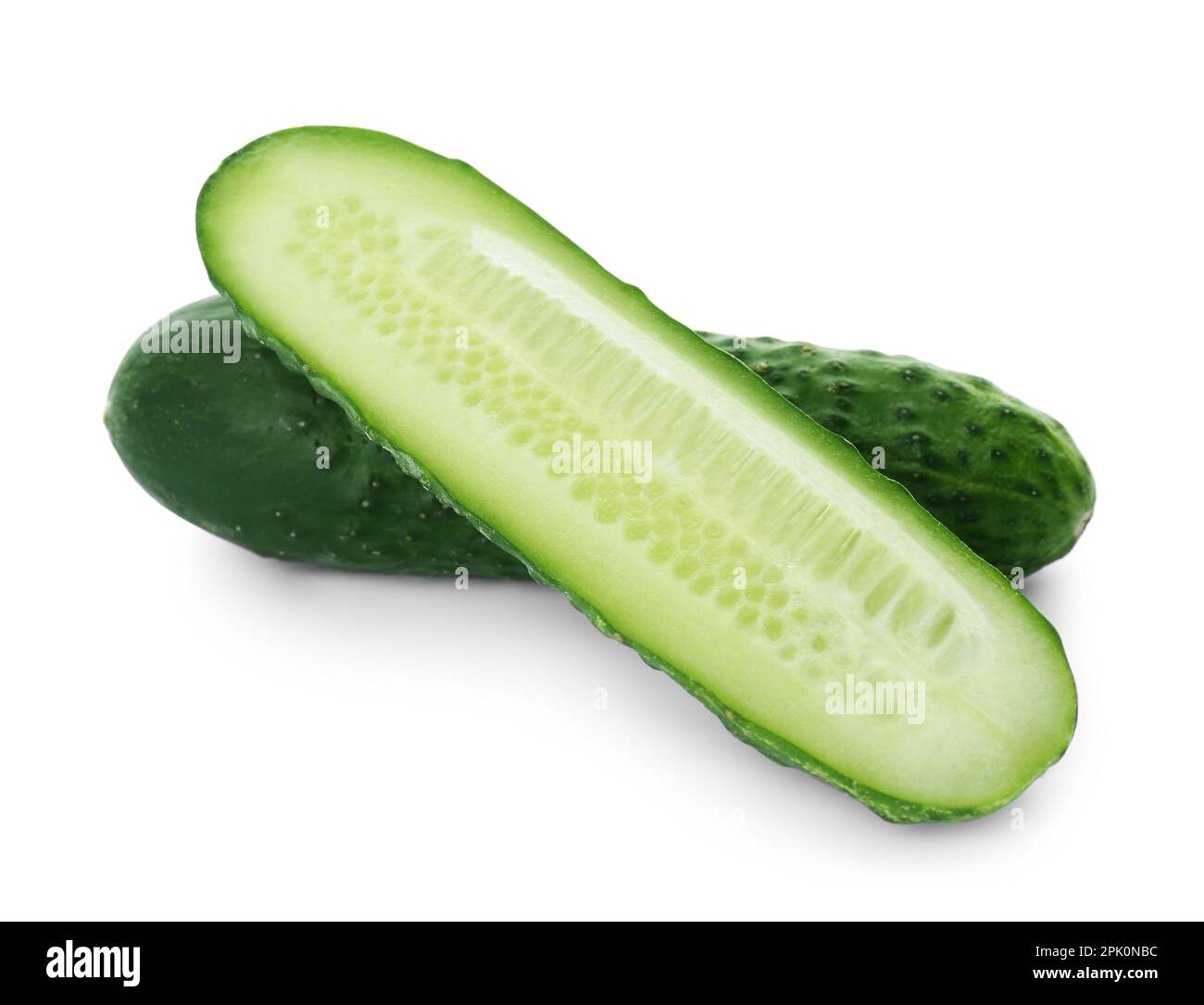 Whole and cut cucumbers on white background Stock Photo - Alamy