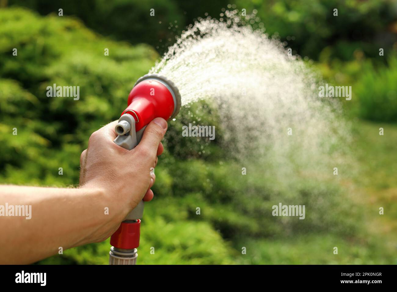 Water spraying from garden hose hi-res stock photography and images - Alamy