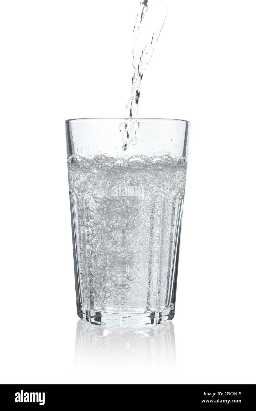 Pouring soda water into glass on white background Stock Photo - Alamy